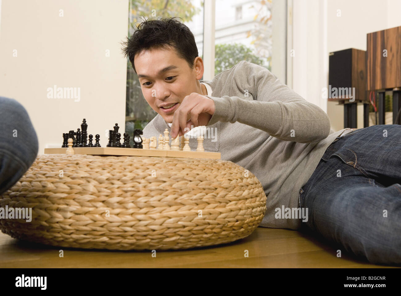 View of a young man playing chess Stock Photo - Alamy