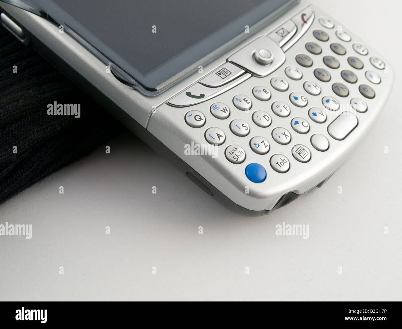 PDA Cellphone with Black Work Business Socks on White Background Stock ...