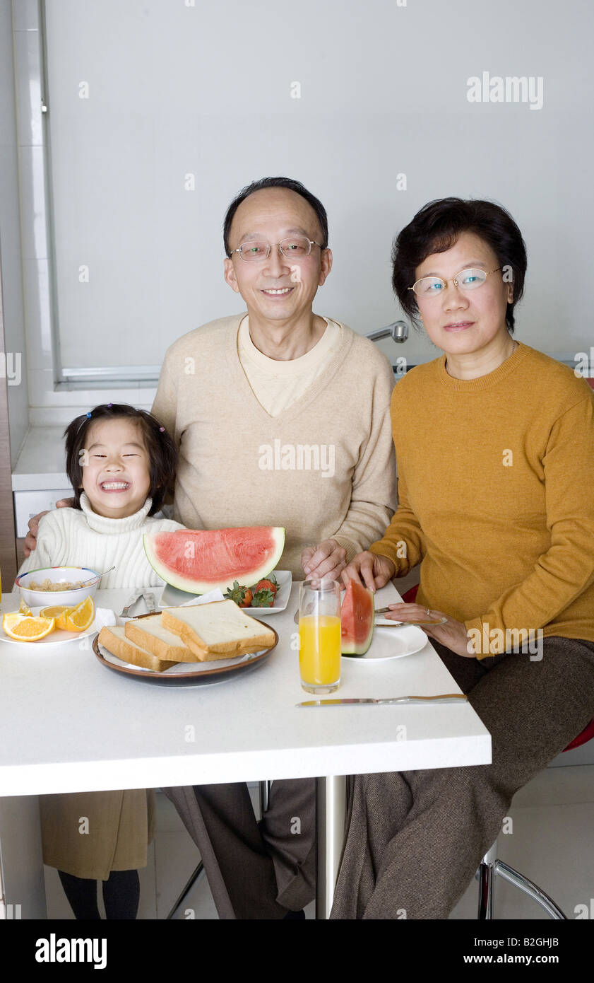 Three women sitting around kitchen table hi-res stock photography and ...