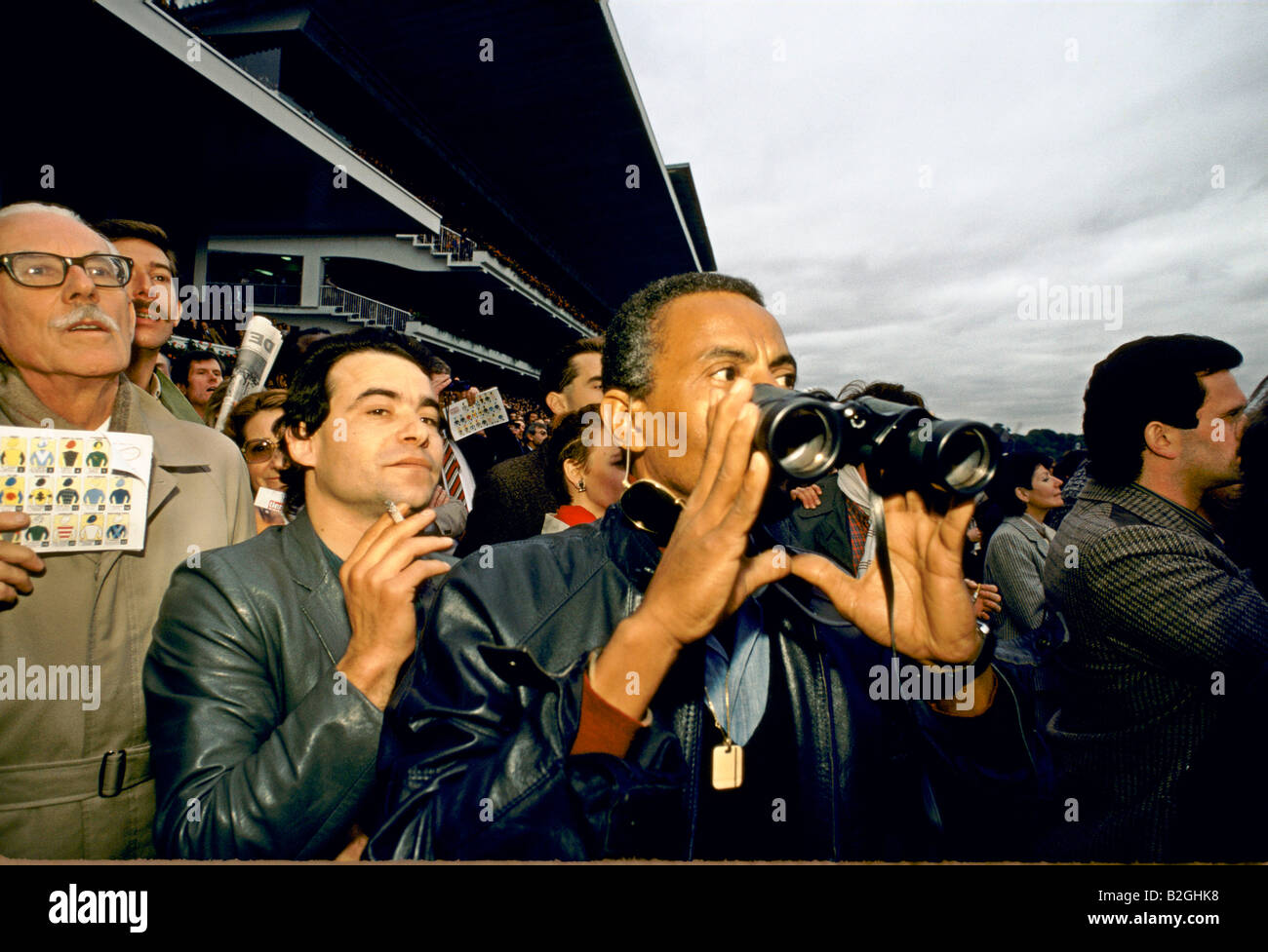 nervous crowds watching horse racing at longchamp, france Stock Photo ...