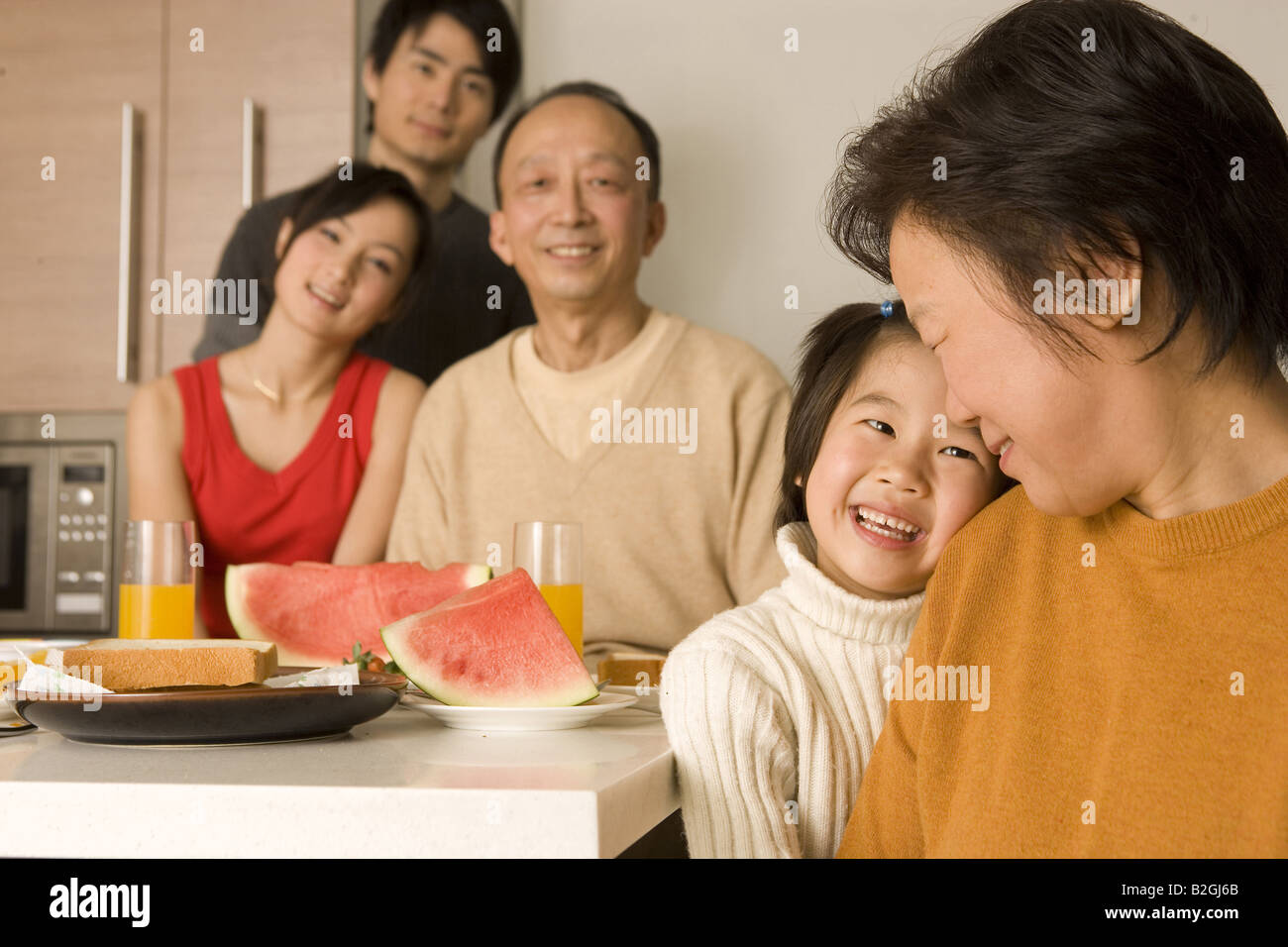 Family members at a breakfast table Stock Photo - Alamy