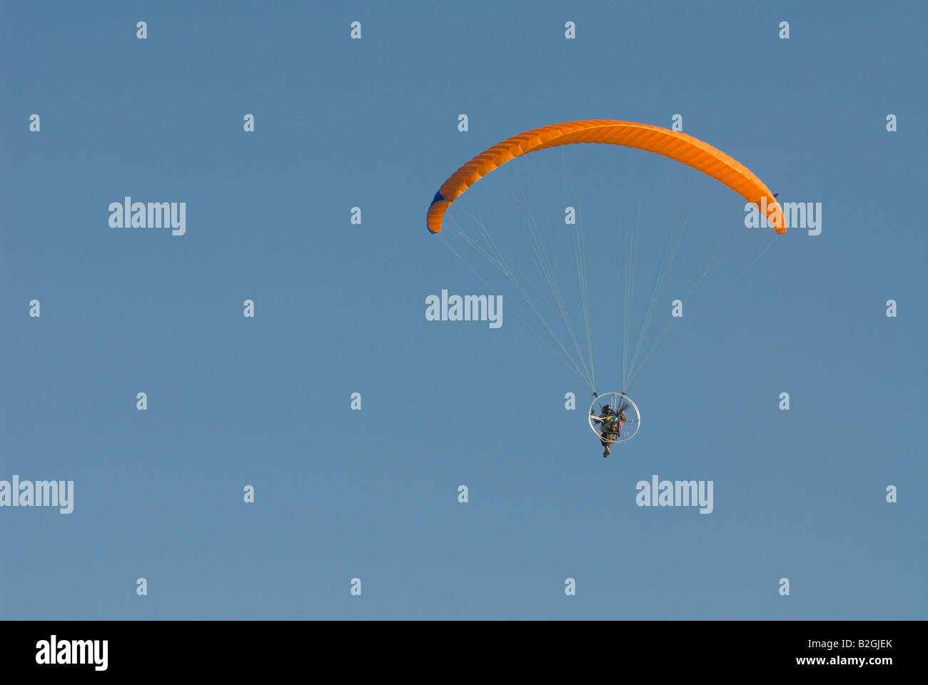 paramotor powered paraglider in flight Stock Photo - Alamy