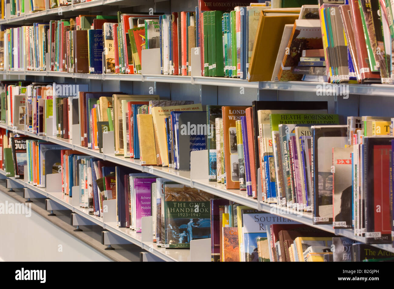 Closeup of a bookshelf in a library, filled with books of different ...