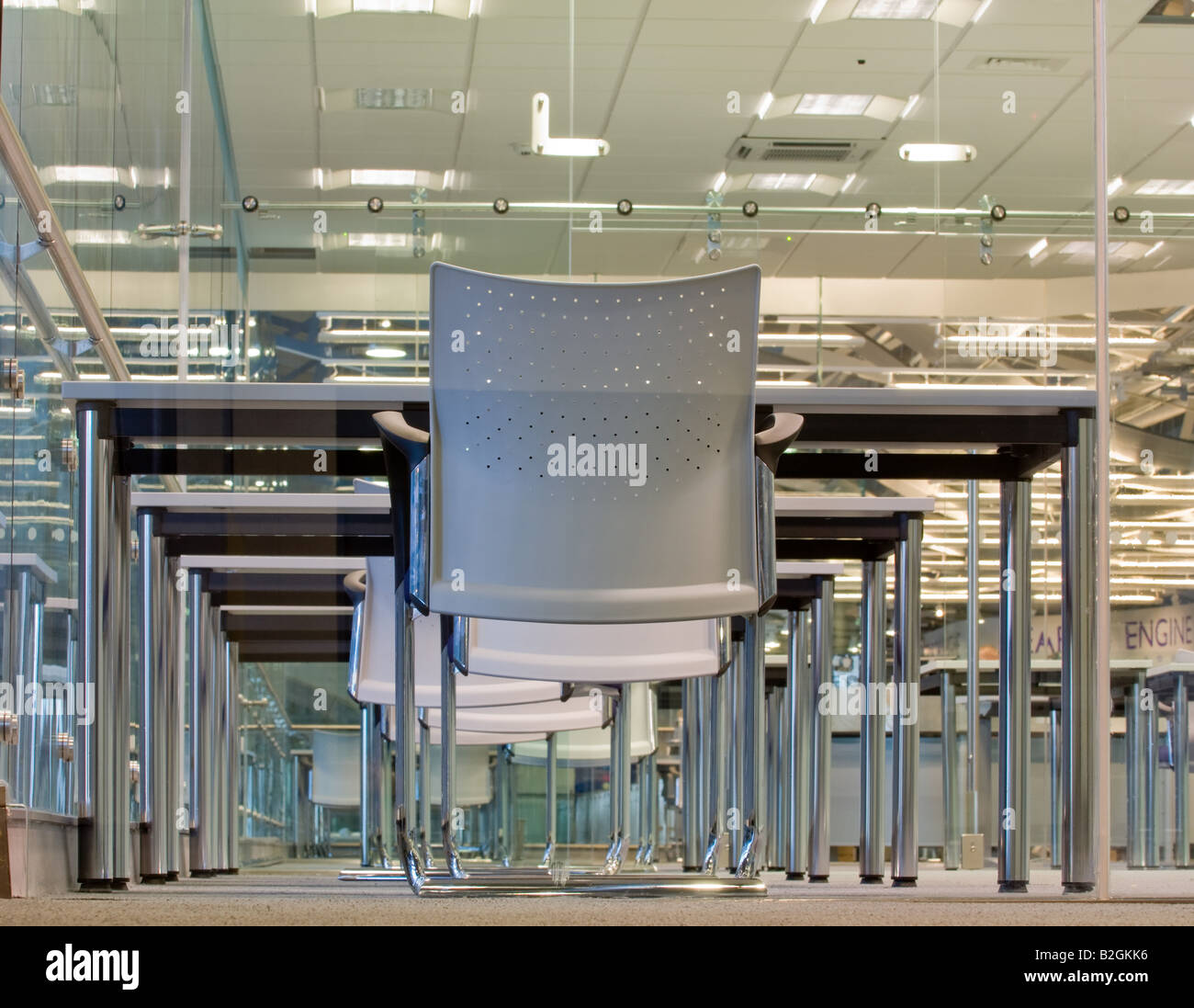 Low angle photo of chairs and desks in modern library Stock Photo - Alamy