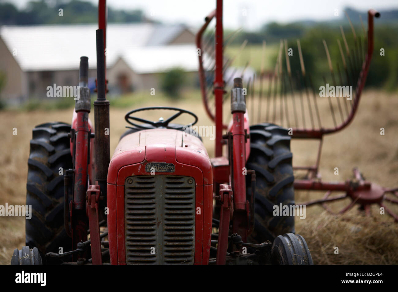 old massey ferguson 35 tractor with haymaker attachment sitting in a ...