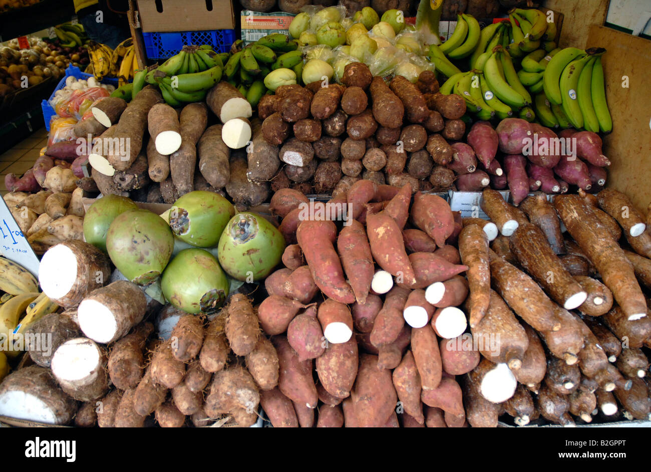 Tropical root vegetables displayed in Brixton Market South London Stock ...