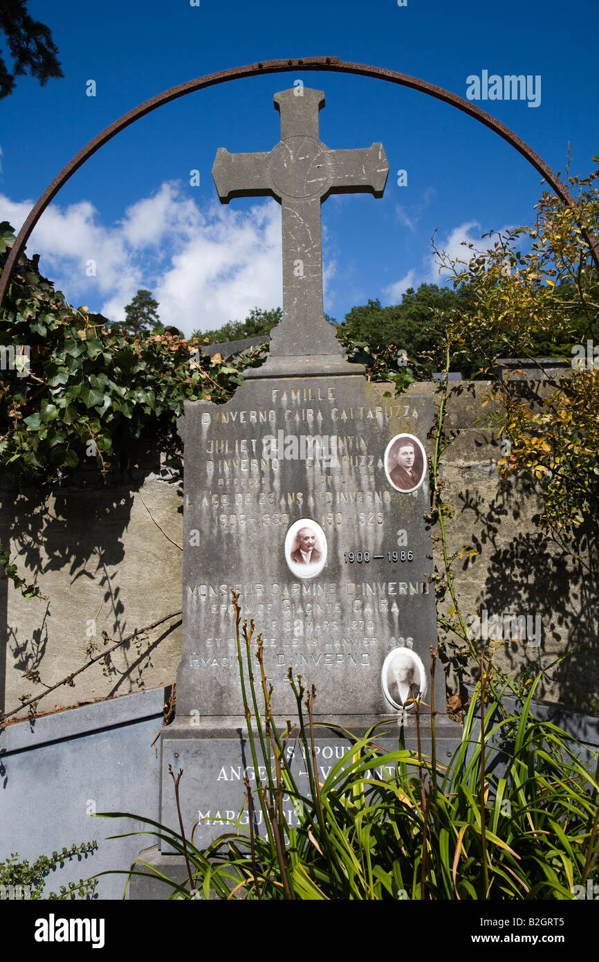 Gravestone with iron arch and family portraits Spa cemetery Belgium ...
