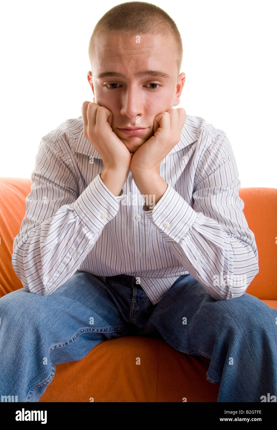 young man sofa sitting lonely boring people Stock Photo - Alamy
