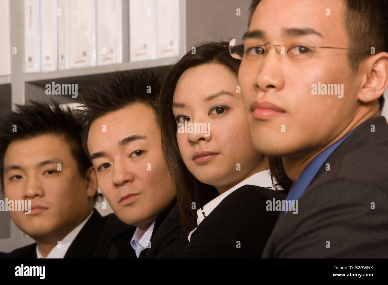 Portrait of four business executives in a meeting Stock Photo - Alamy