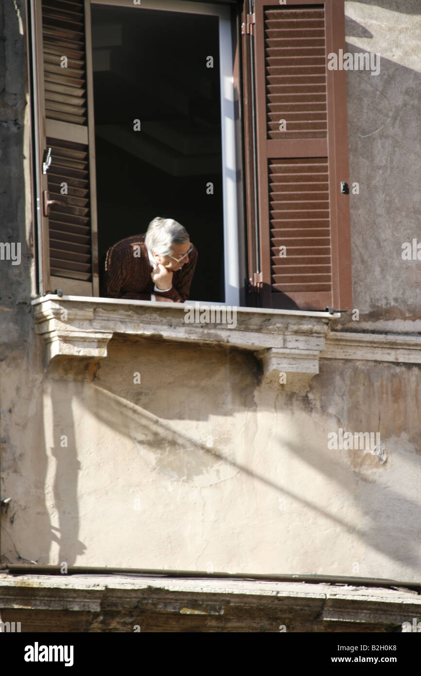 Person looking out window rome hi-res stock photography and images - Alamy