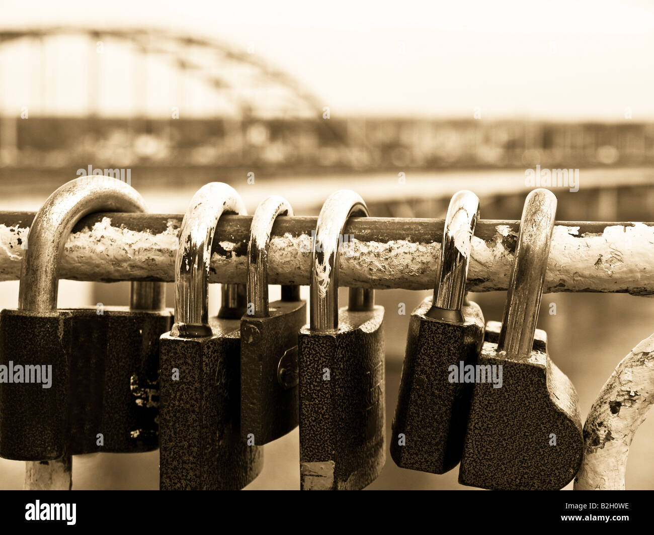 Padlocks Hanging On A Railing Stock Photo - Alamy
