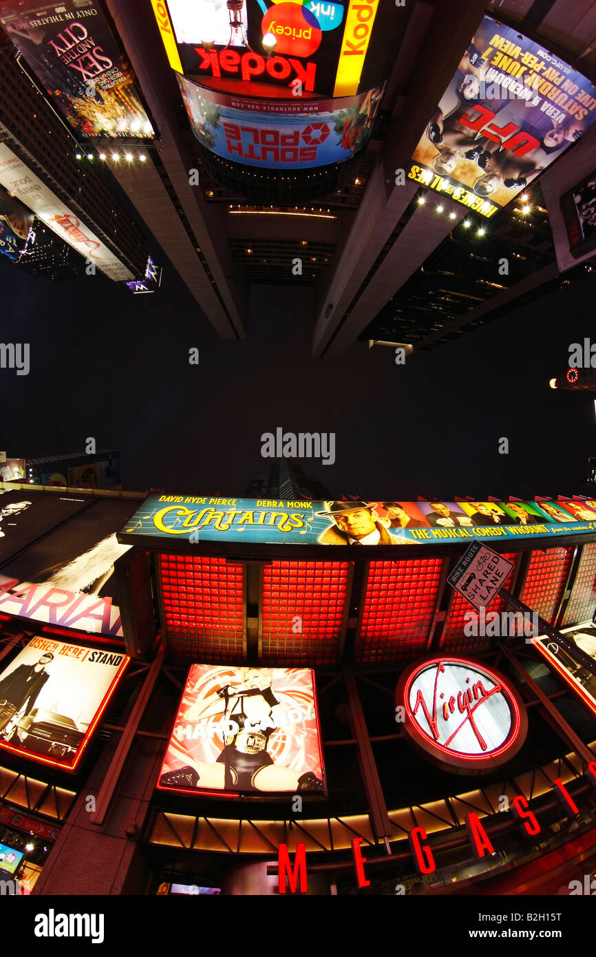 Low angle fish-eye view of Times Square at night - New York City, USA ...