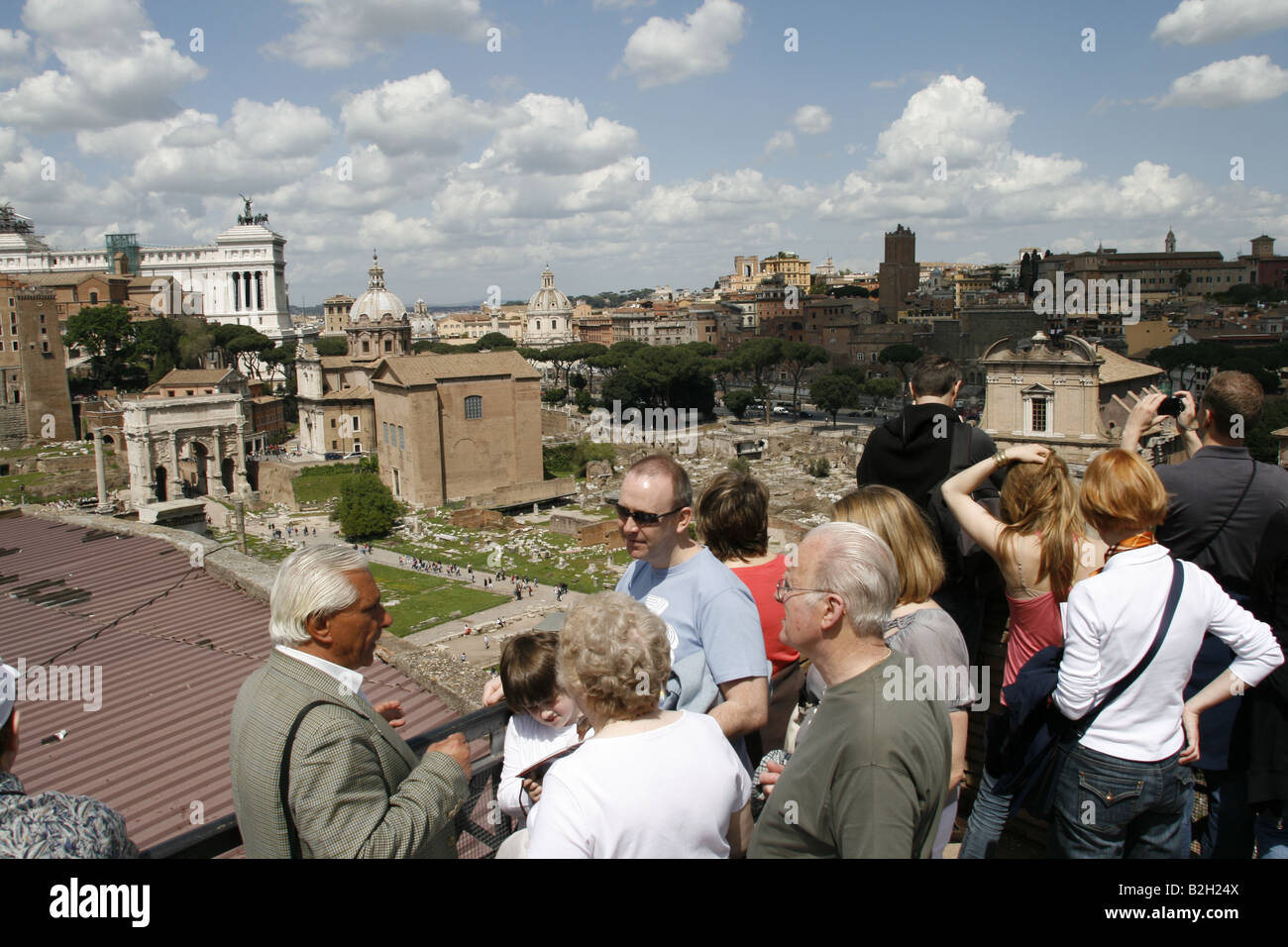 group tourists looking at roman forum, rome, italy Stock Photo - Alamy