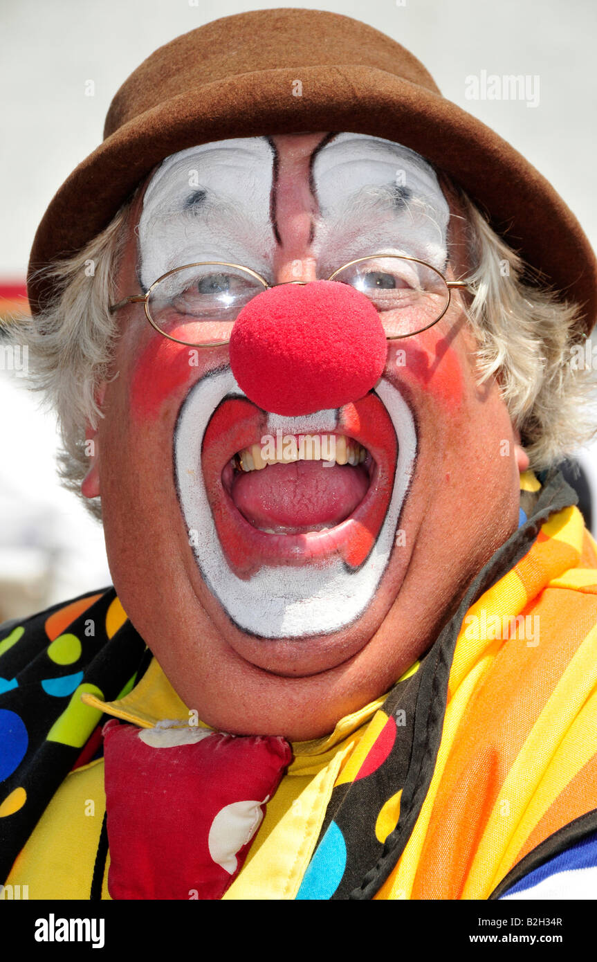 Smiling happy colorful clown Stock Photo - Alamy