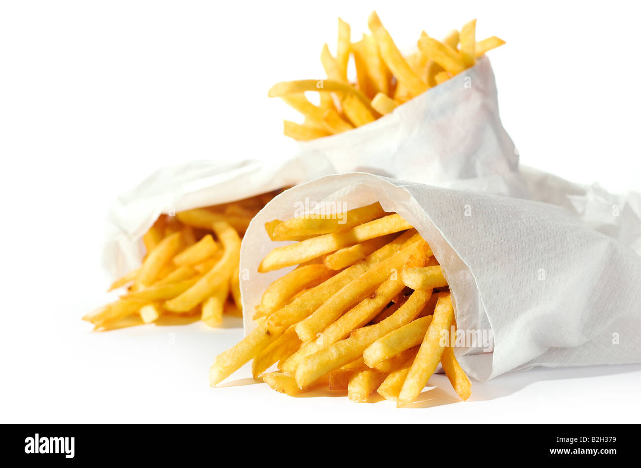 Three packs of french fries Stock Photo - Alamy