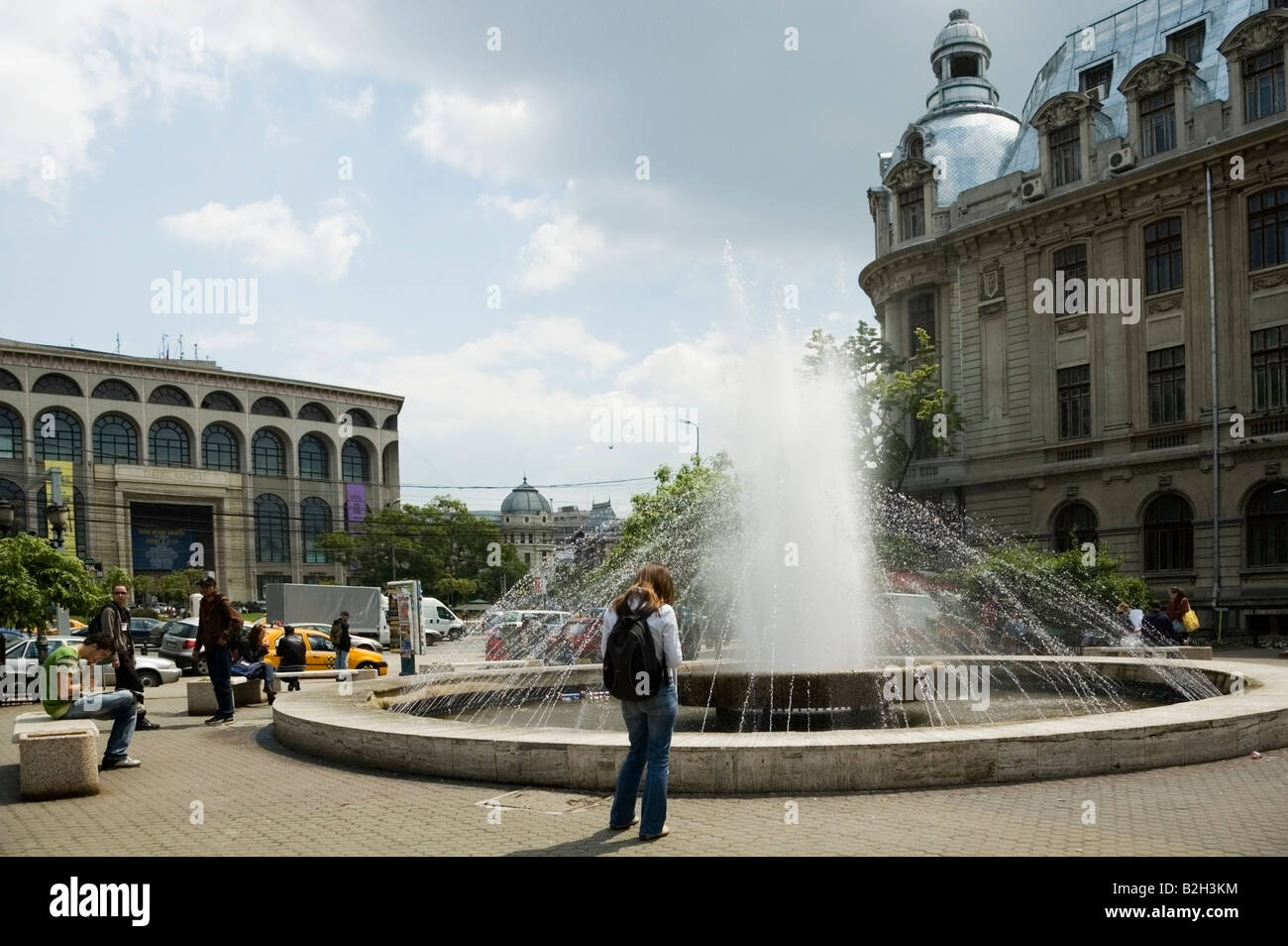 Young Romanian people, students relaxing by cascading fountain near ...