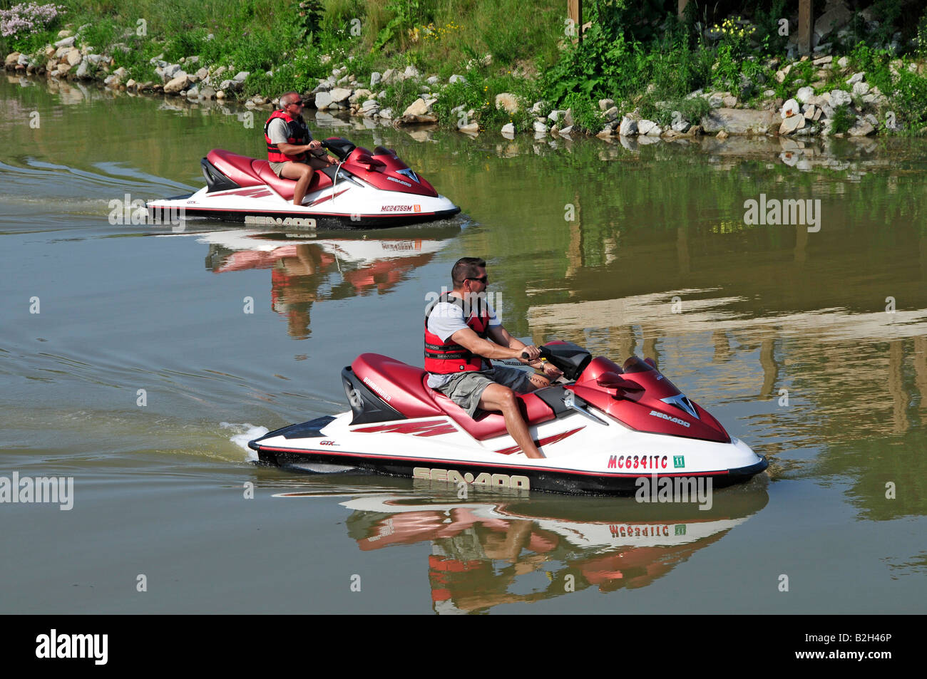 Adult men on a Sea Doo wave runner Stock Photo - Alamy