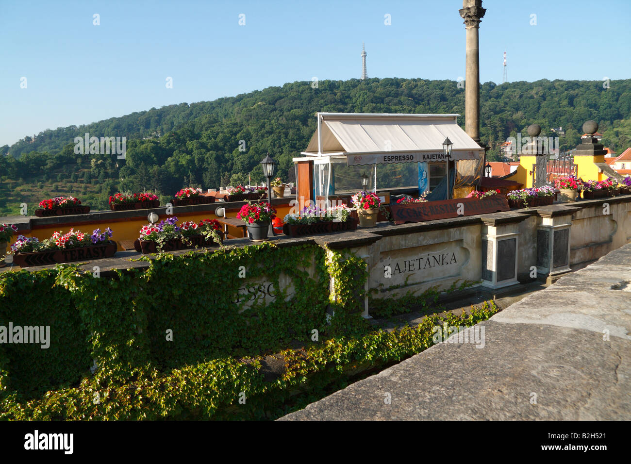 A small cafe restaurant decorated with beautiful flowers located on a ...