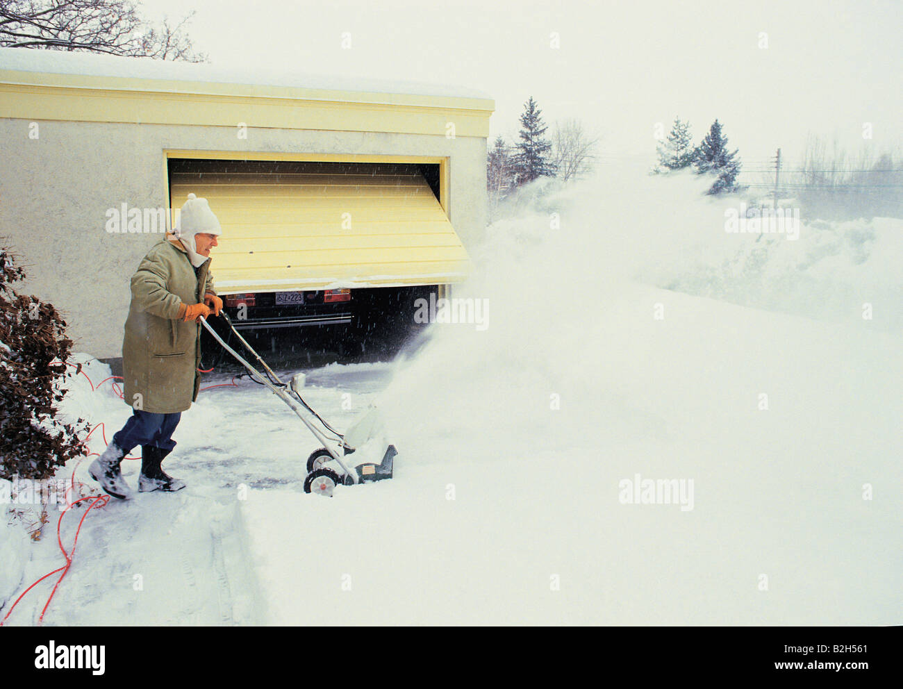 Canada. Ontario. Winter weather. Snow clearance from front of garage ...