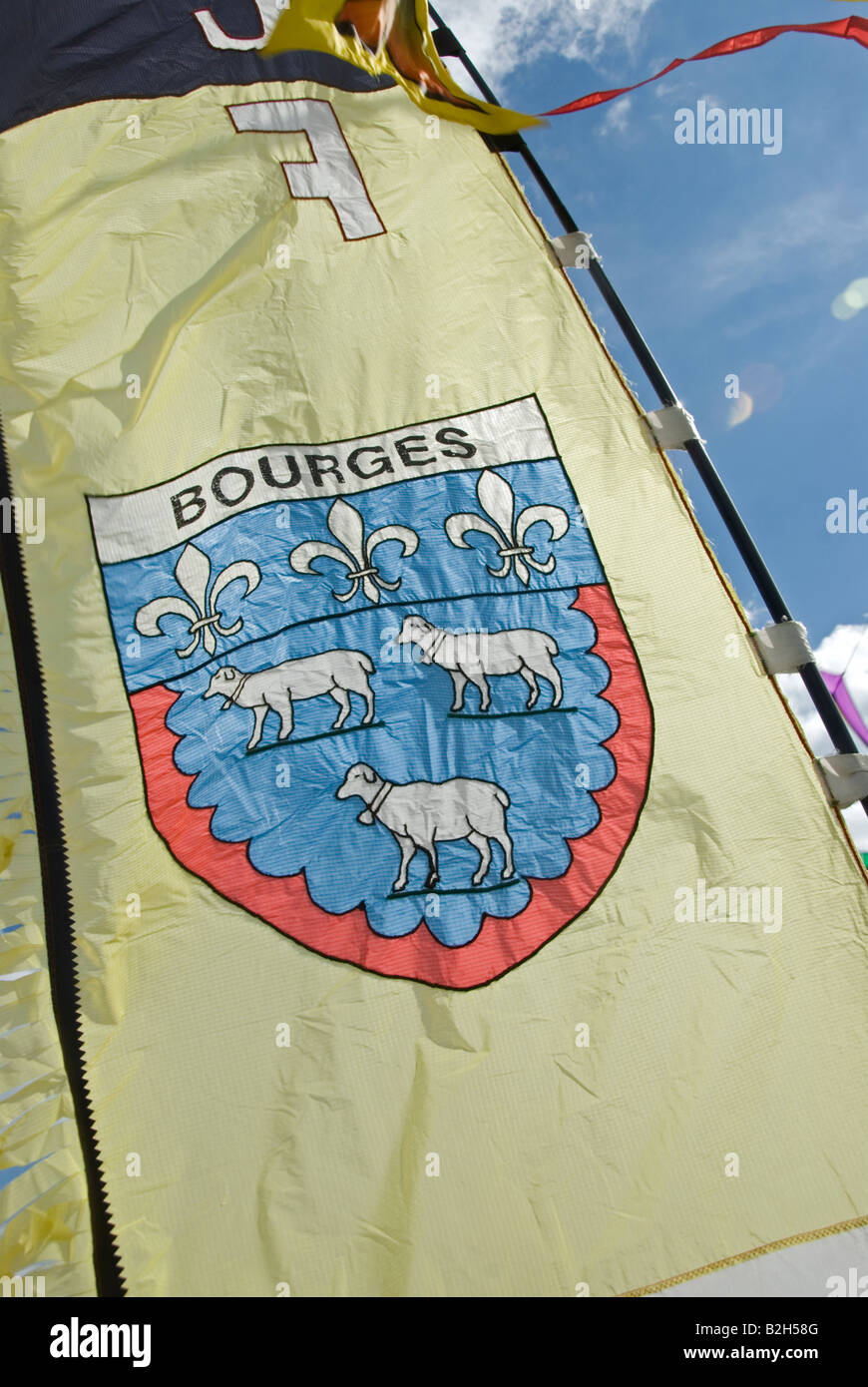 Stock photo of a flag flying the crest of the city of Bourges located ...