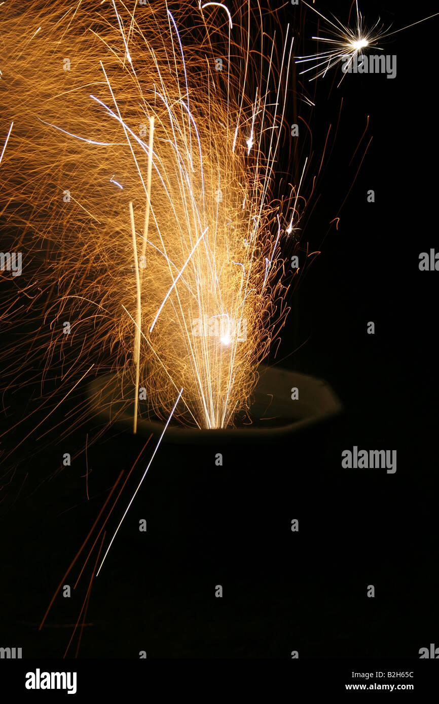 colourful sparks in fireworks display in garden Stock Photo - Alamy