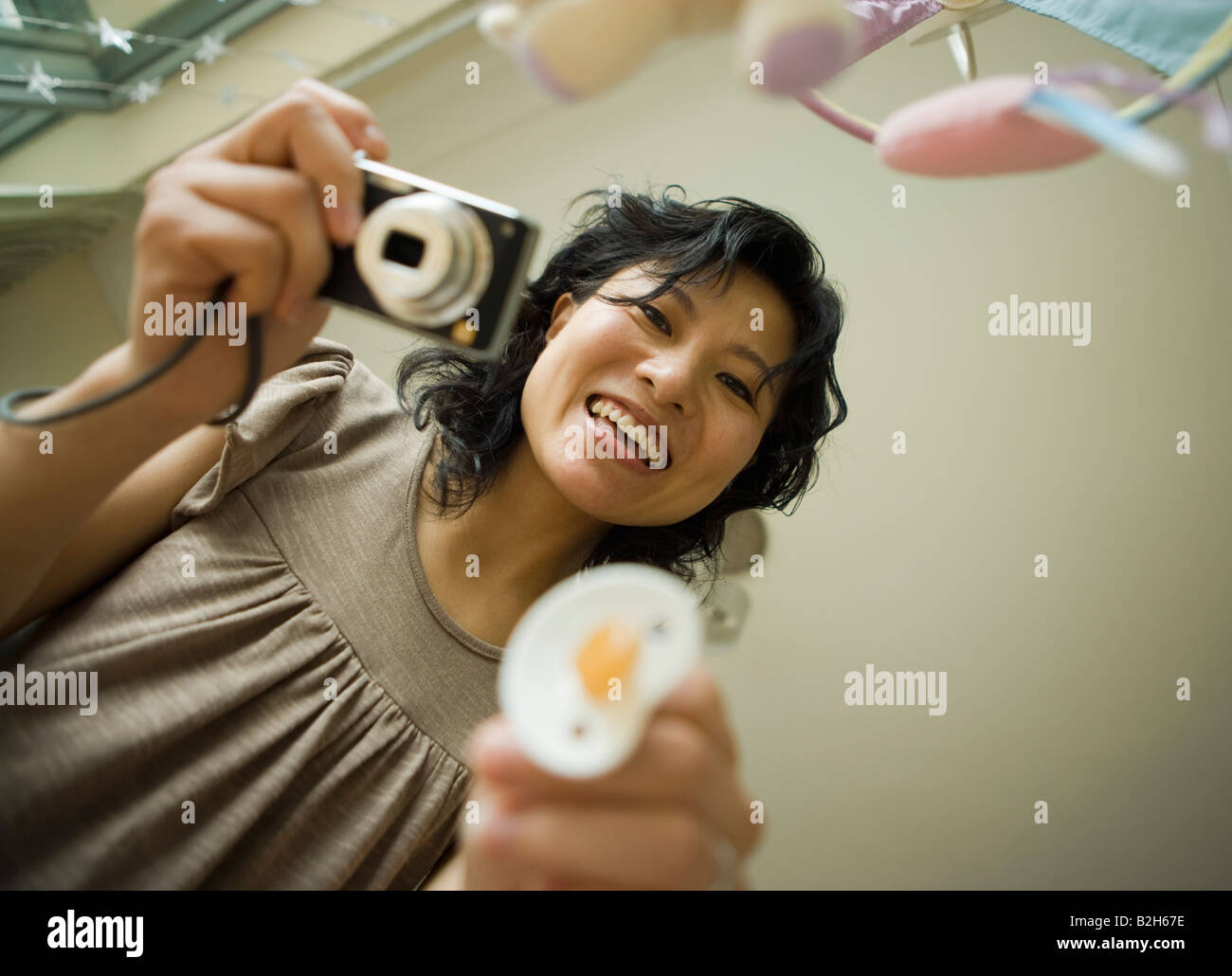 Mid adult woman smiling camera hi-res stock photography and images - Alamy