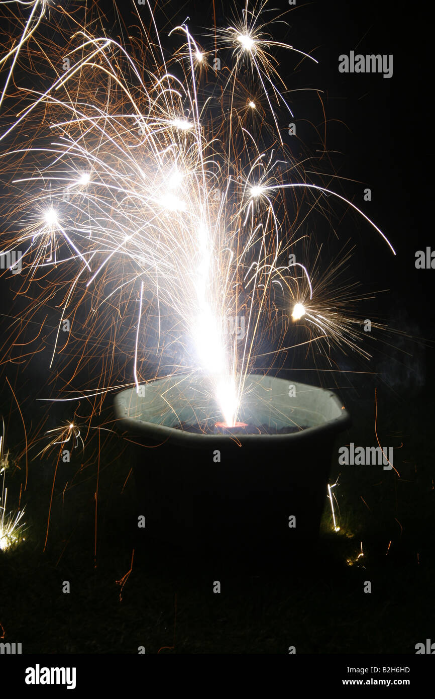 colourful sparks in fireworks display in garden Stock Photo - Alamy