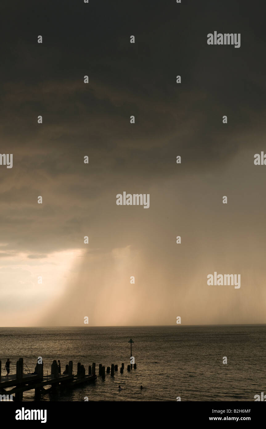 dramatic summer storm rain clouds over the sea Aberystwyth Wales ...