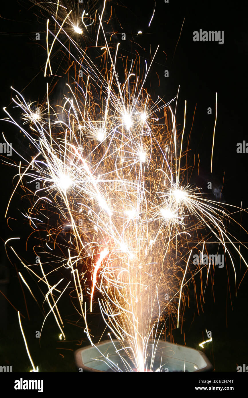 colourful sparks in fireworks display in garden Stock Photo - Alamy