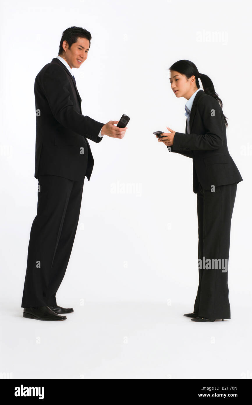 Two people showing phone Cut Out Stock Images & Pictures - Alamy