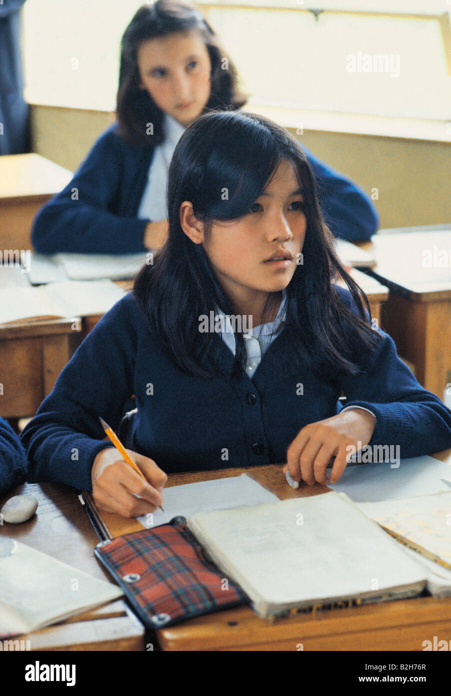 Close-up of school girls studying in classroom Stock Photo - Alamy