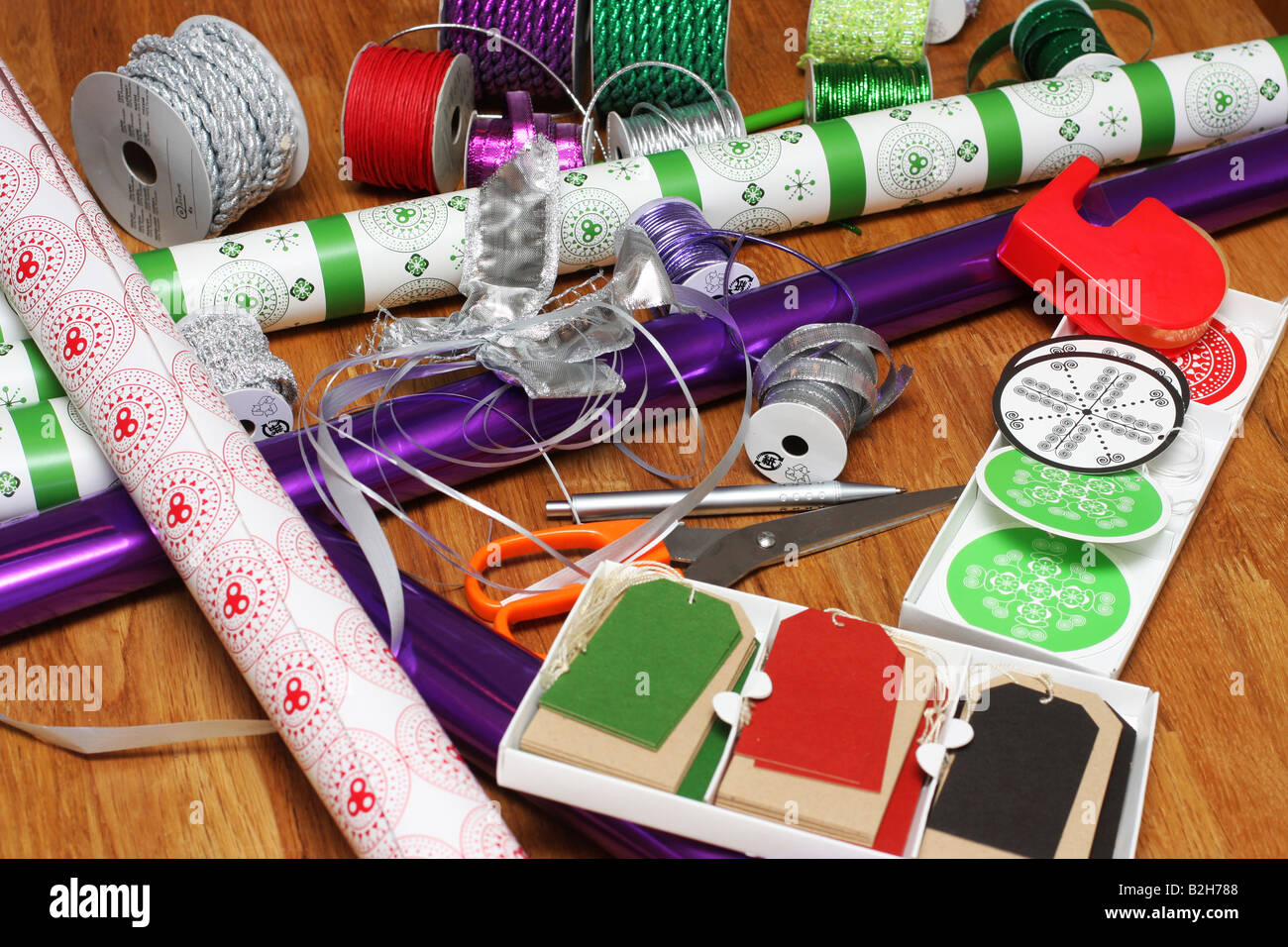 a bunch of wrapping paper ribbons label tags and other present wrapping ...