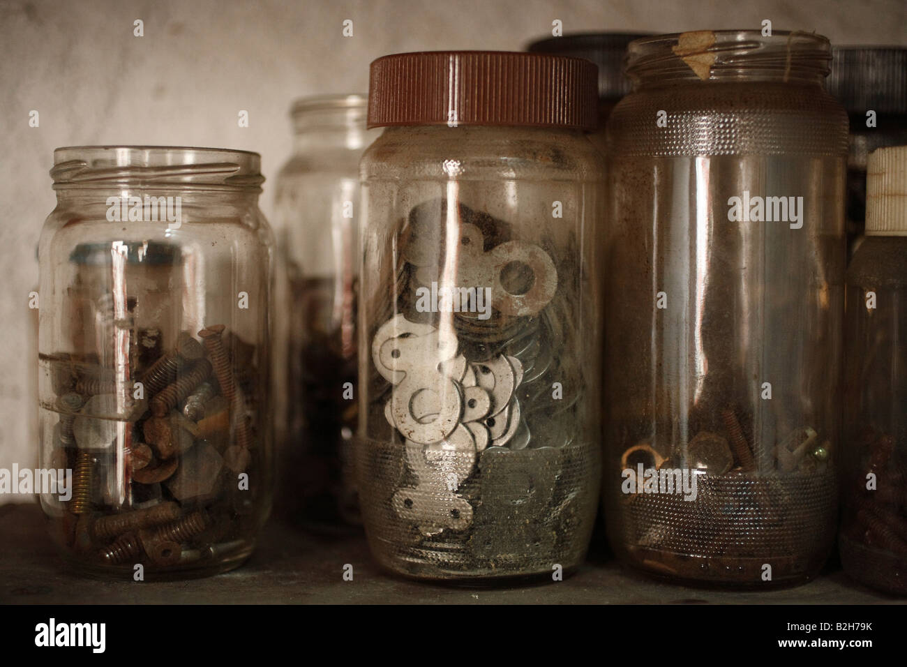 Nuts and bolts stored in jars Stock Photo - Alamy