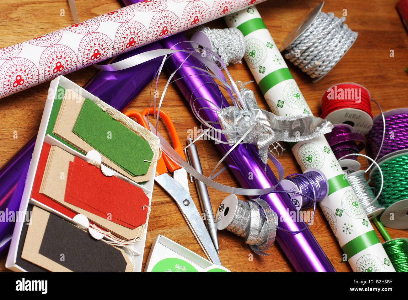 a bunch of wrapping paper ribbons label tags and other present wrapping ...