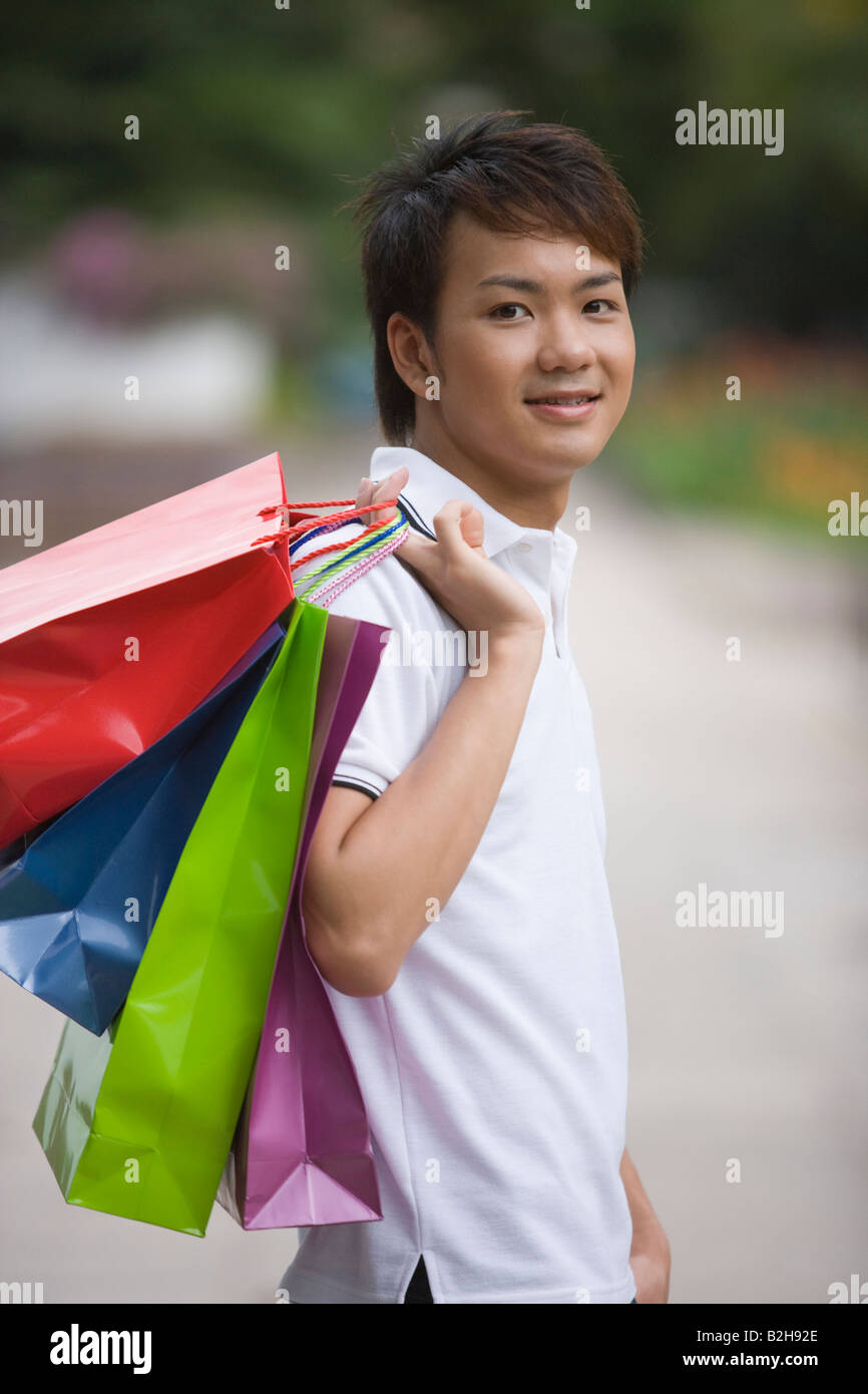 Chinese man carrying shopping bags hi-res stock photography and images ...