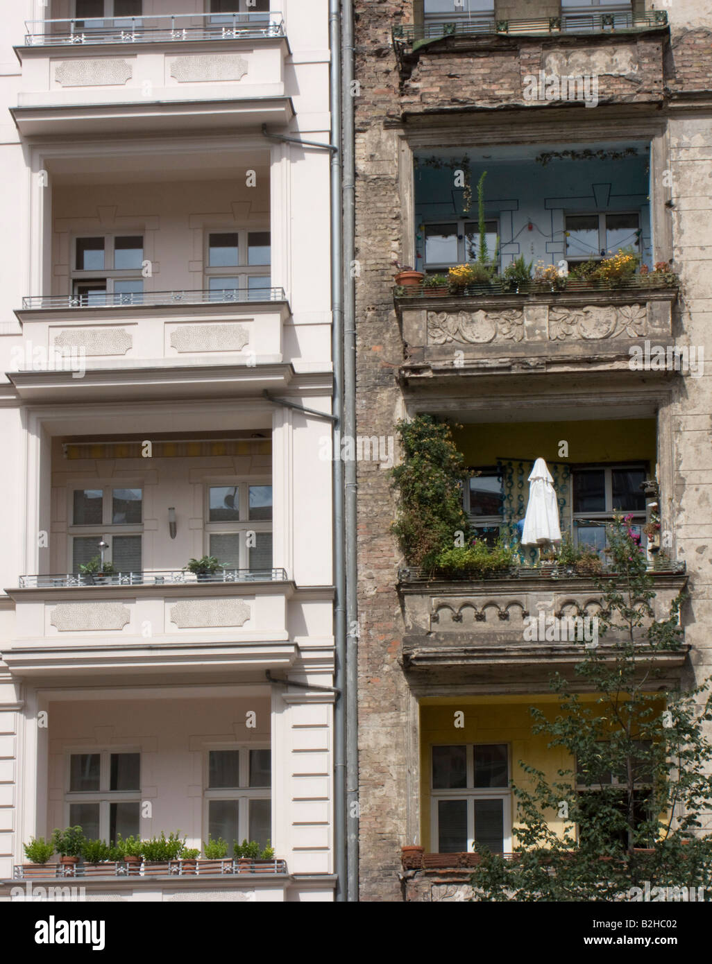 Contrasting old and renovated facades of apartment tenement buildings ...