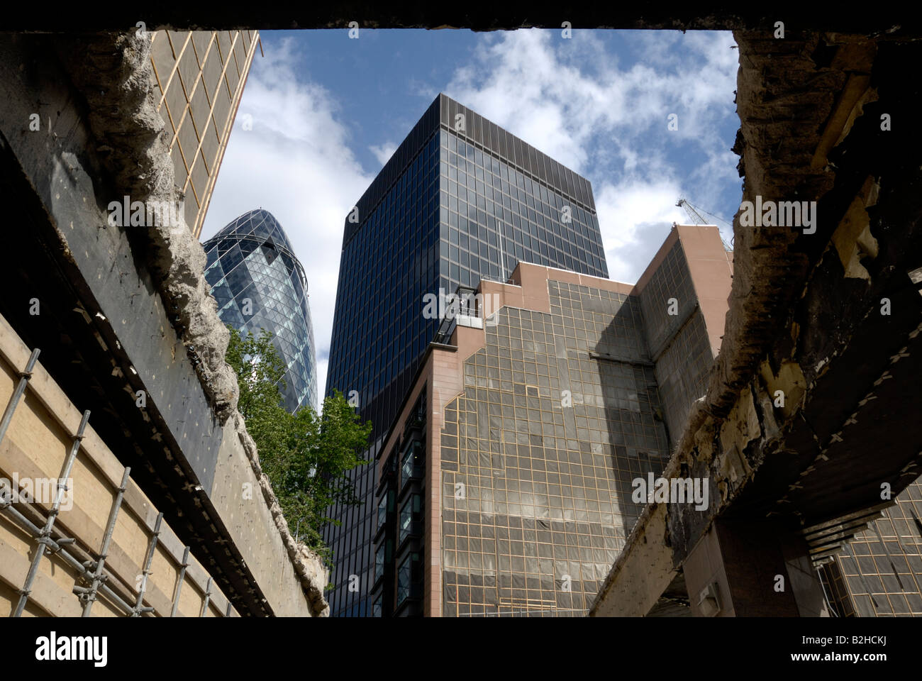 Low angle view of office blocks against cloudy sky Stock Photo - Alamy