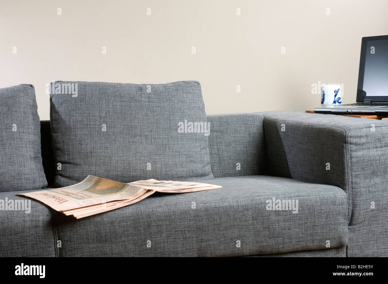 business paper lying on empty sofa Stock Photo - Alamy