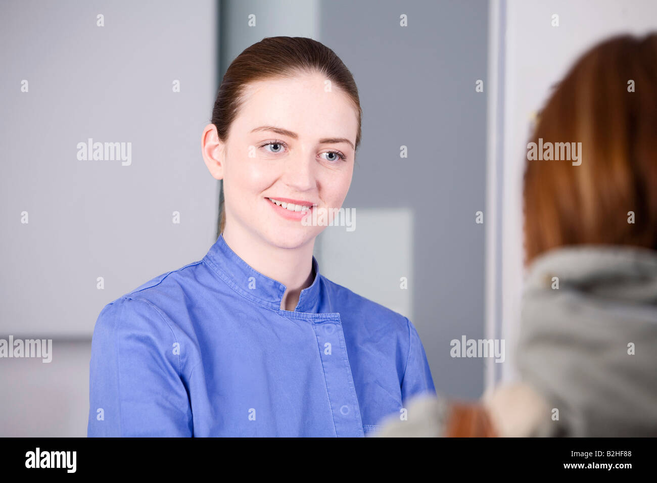 medical assistant talking to patient Stock Photo - Alamy