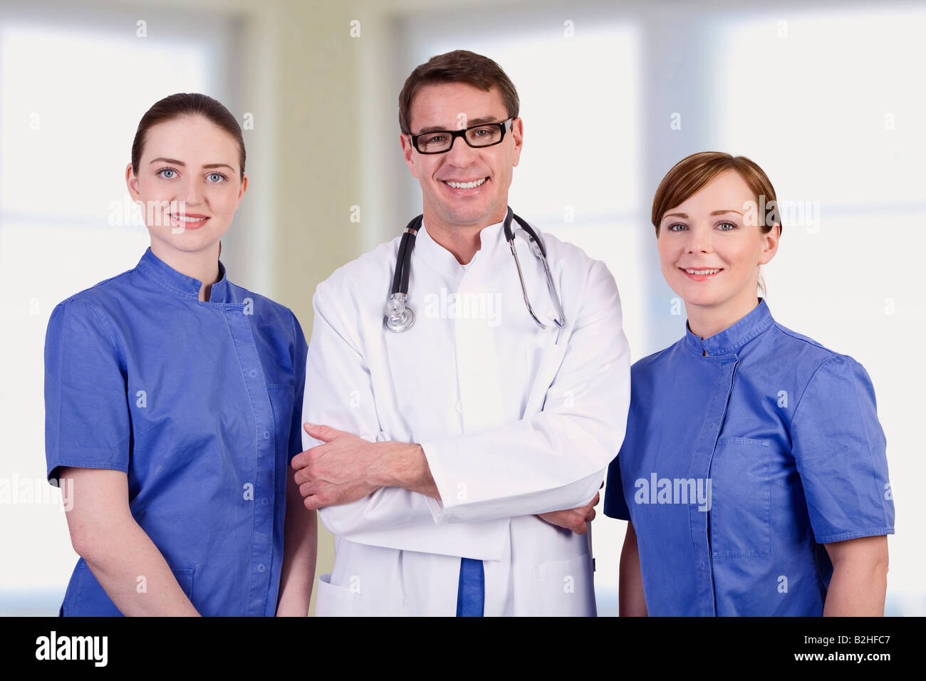 portrait of doctor with two nurses Stock Photo - Alamy