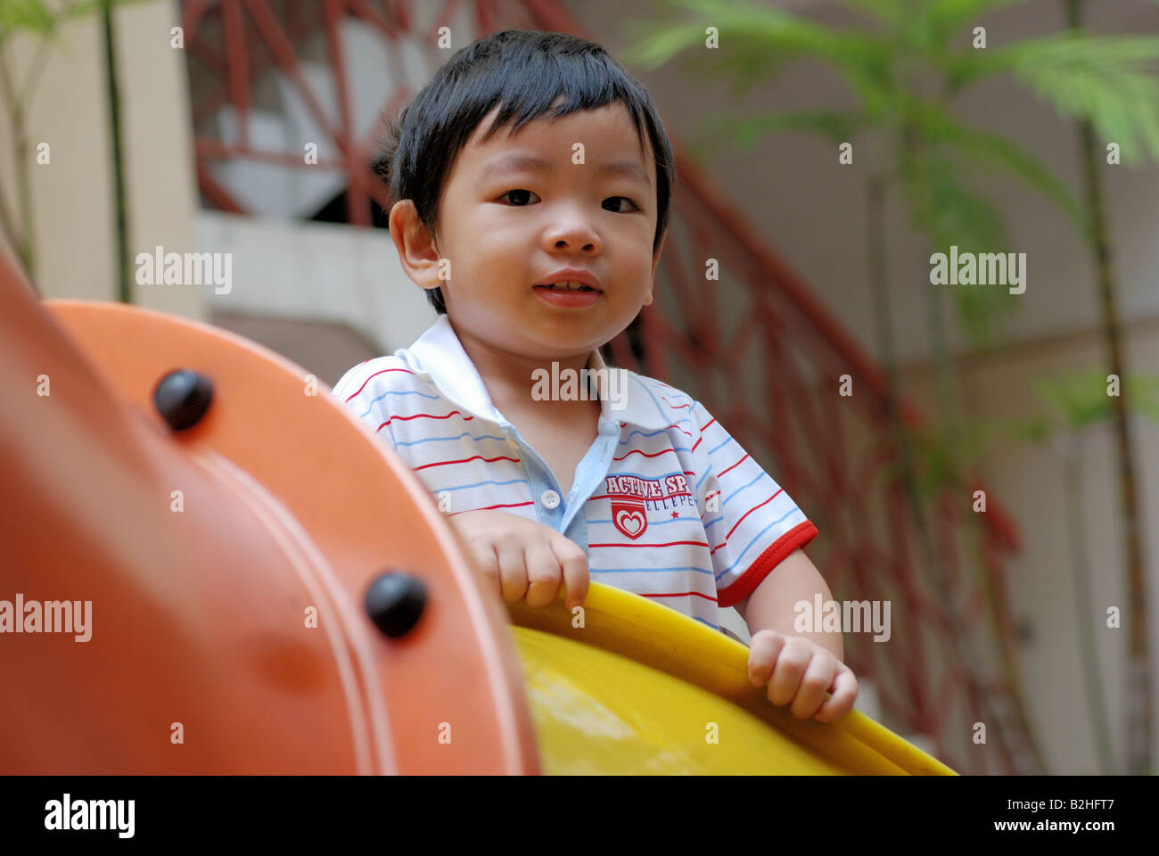 Chinese boy smiling happily Stock Photo - Alamy