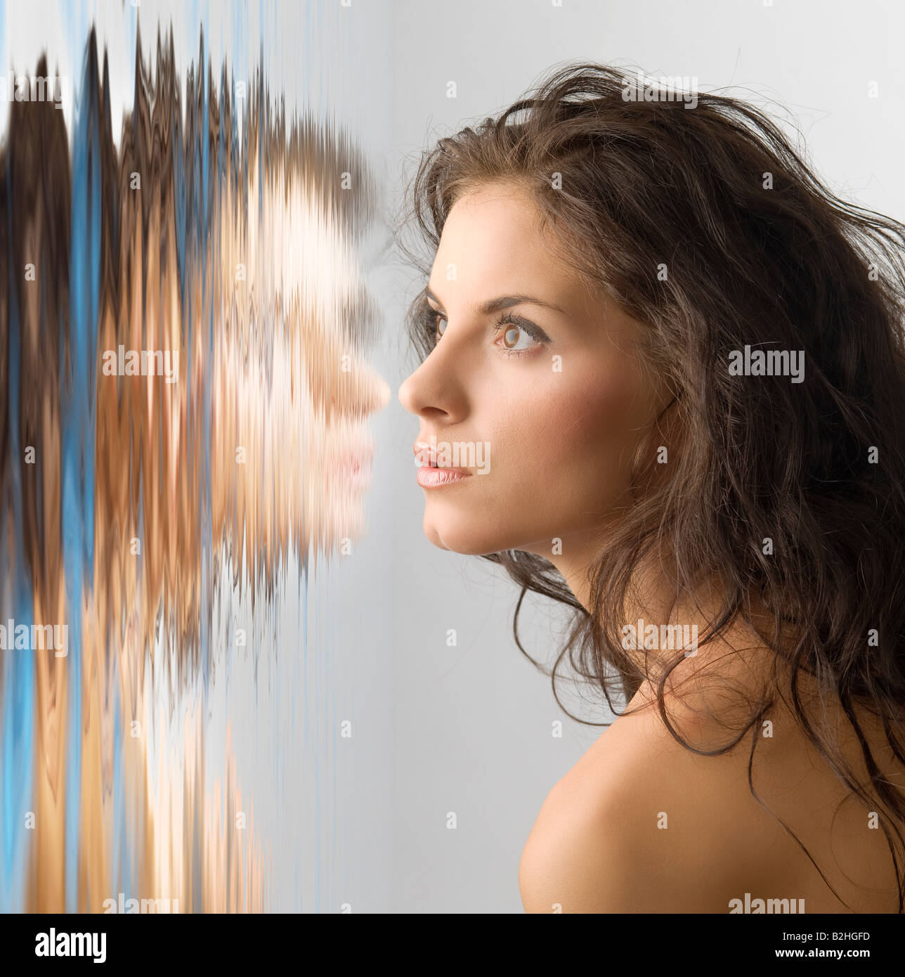 cute girl on her left side looking far away with light coming on her ...