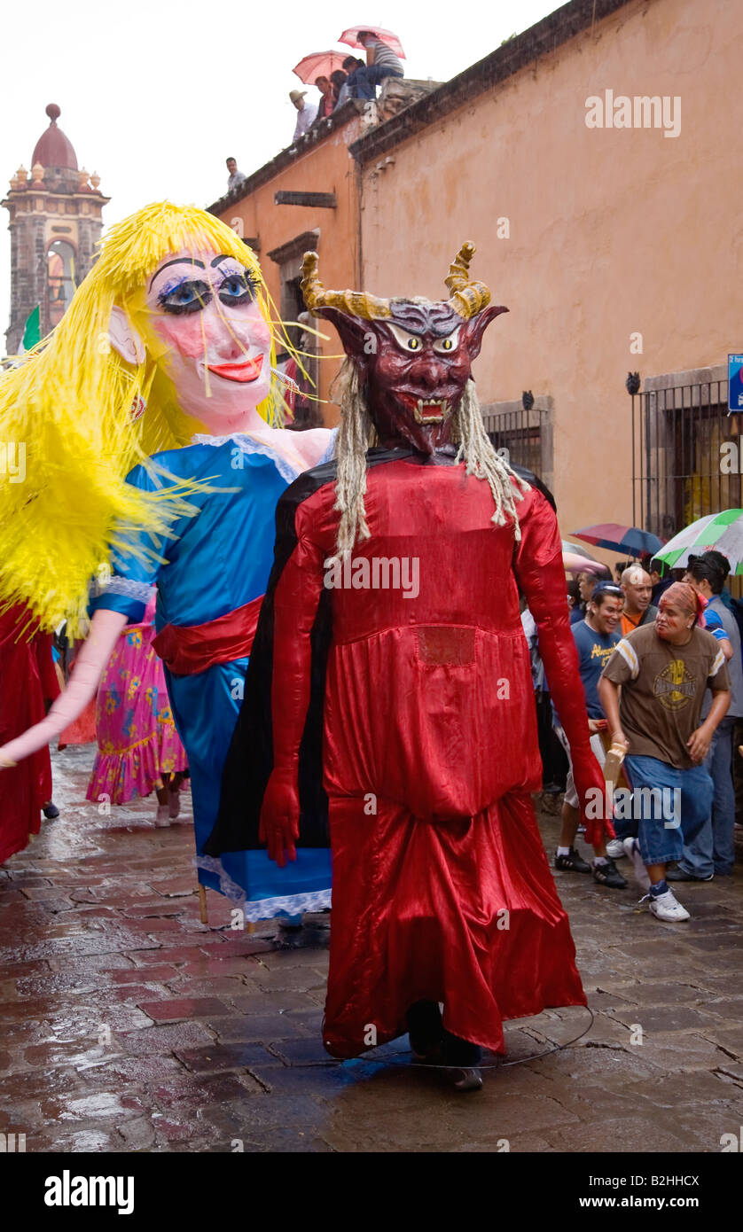 A giant DEVIL other stilt walkers in the FESTIVAL DE SAN MIGUEL ...
