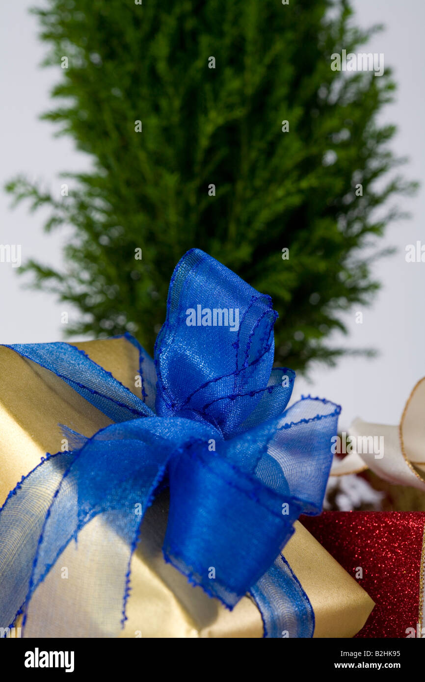 still life of christmas presents and small tree Stock Photo - Alamy