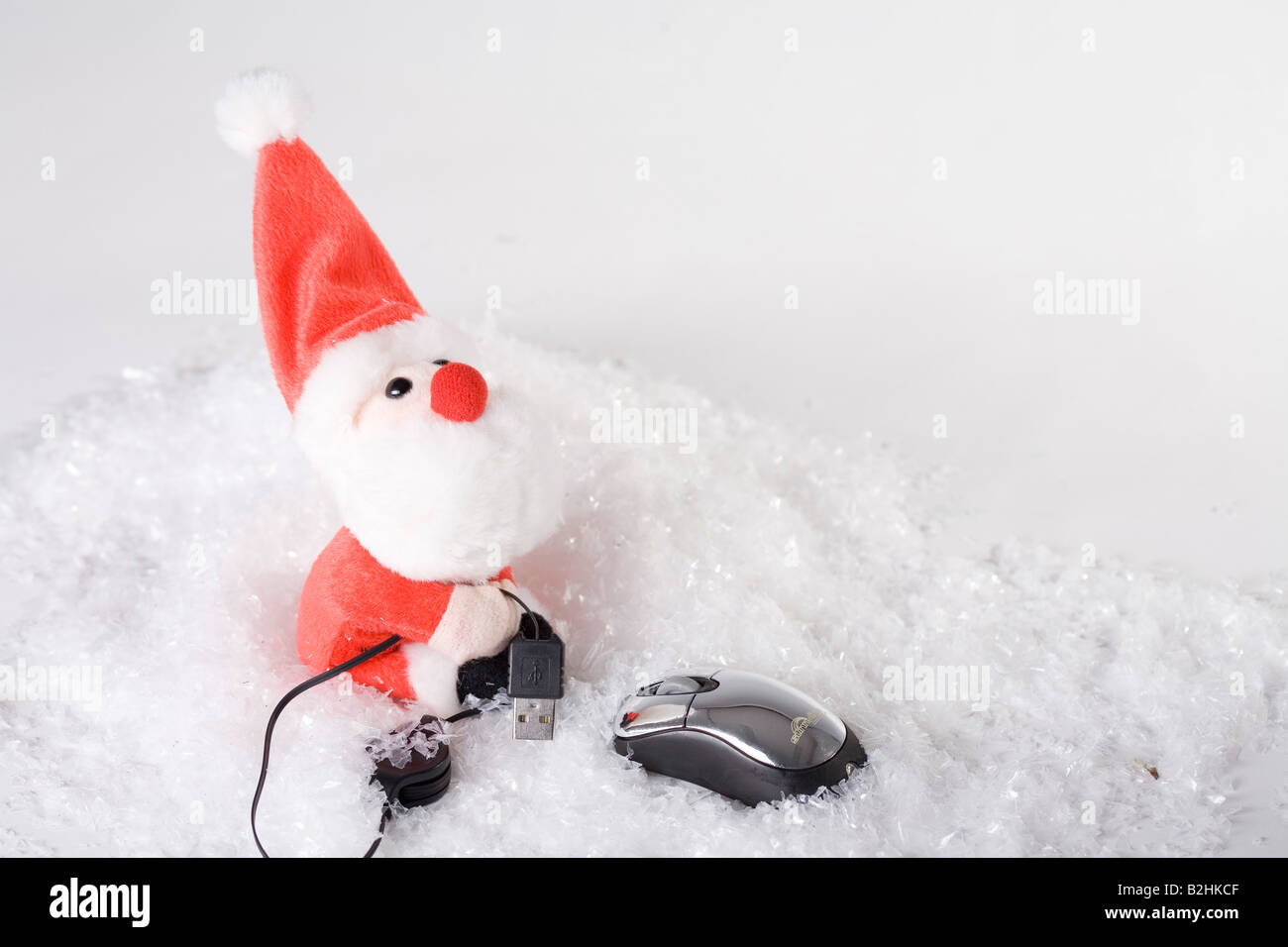 toy santa claus with computer mouse Stock Photo - Alamy