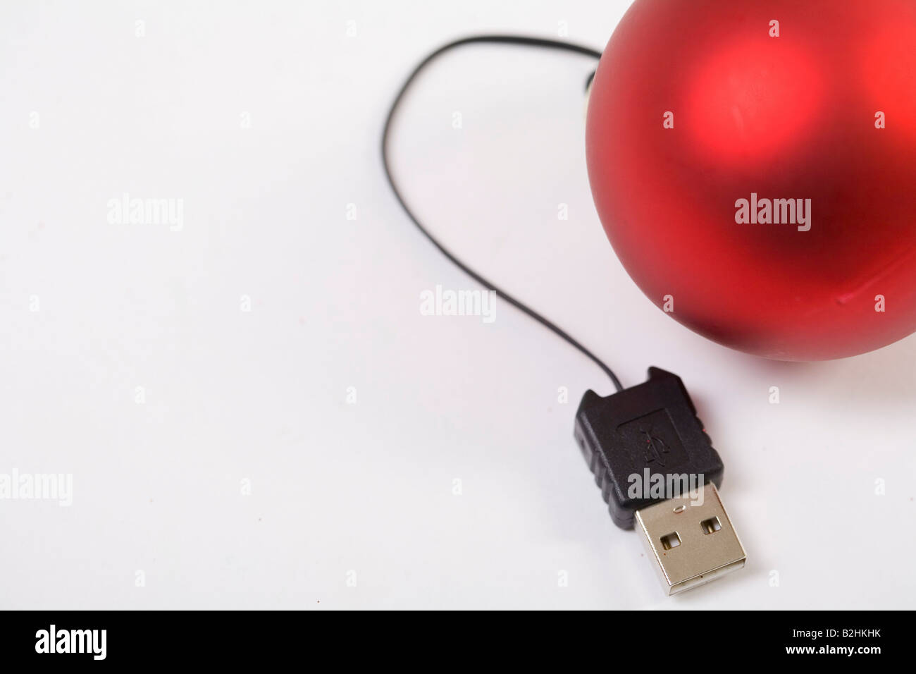 still life of bauble connected to computer cable Stock Photo - Alamy