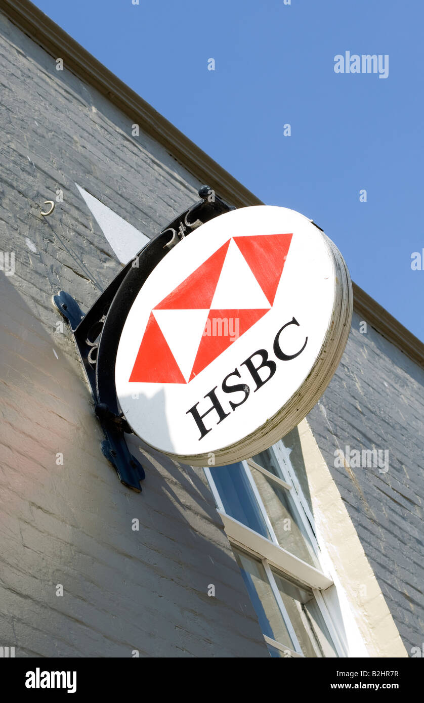 Old HSBC sign fixed to wall under blue sky Stock Photo - Alamy