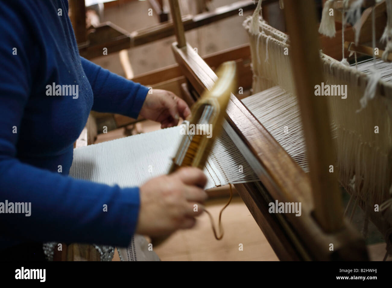 An azorean craftswoman weaving. Azores islands, Portugal Stock Photo ...