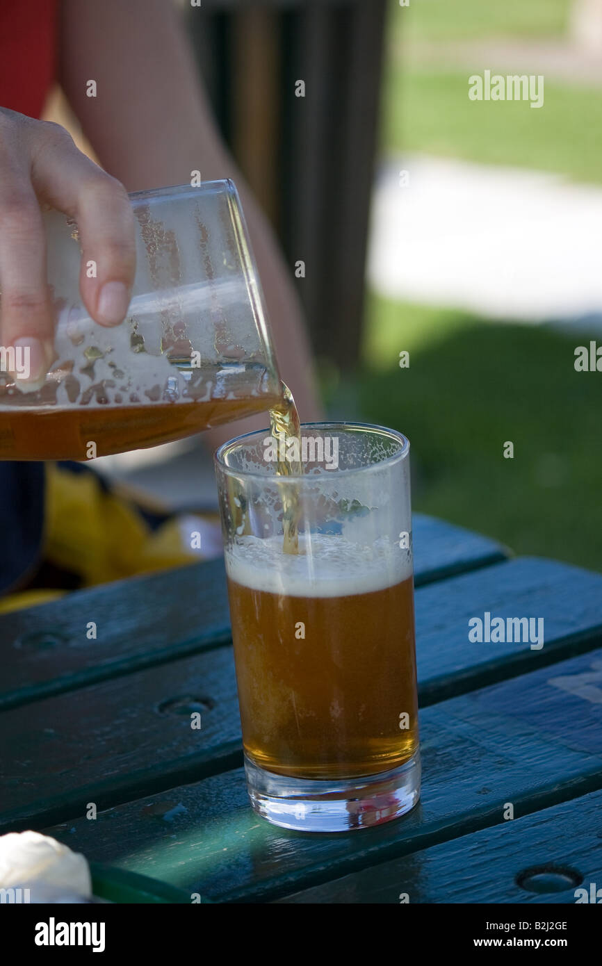 Half pint of real ale being topped up Stock Photo - Alamy
