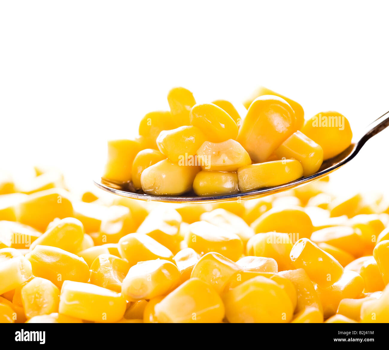 Corn on a spoon Stock Photo - Alamy